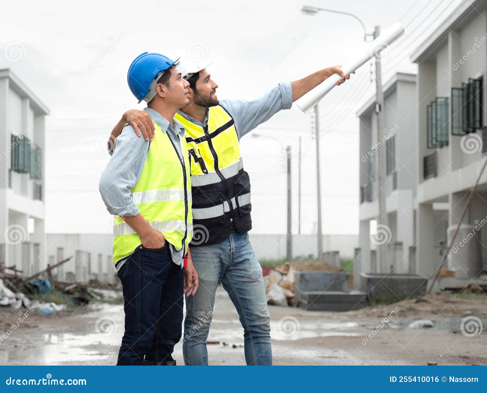 Engineer Man and Architect, Contractor Wear Safety Helmets Discuss ...