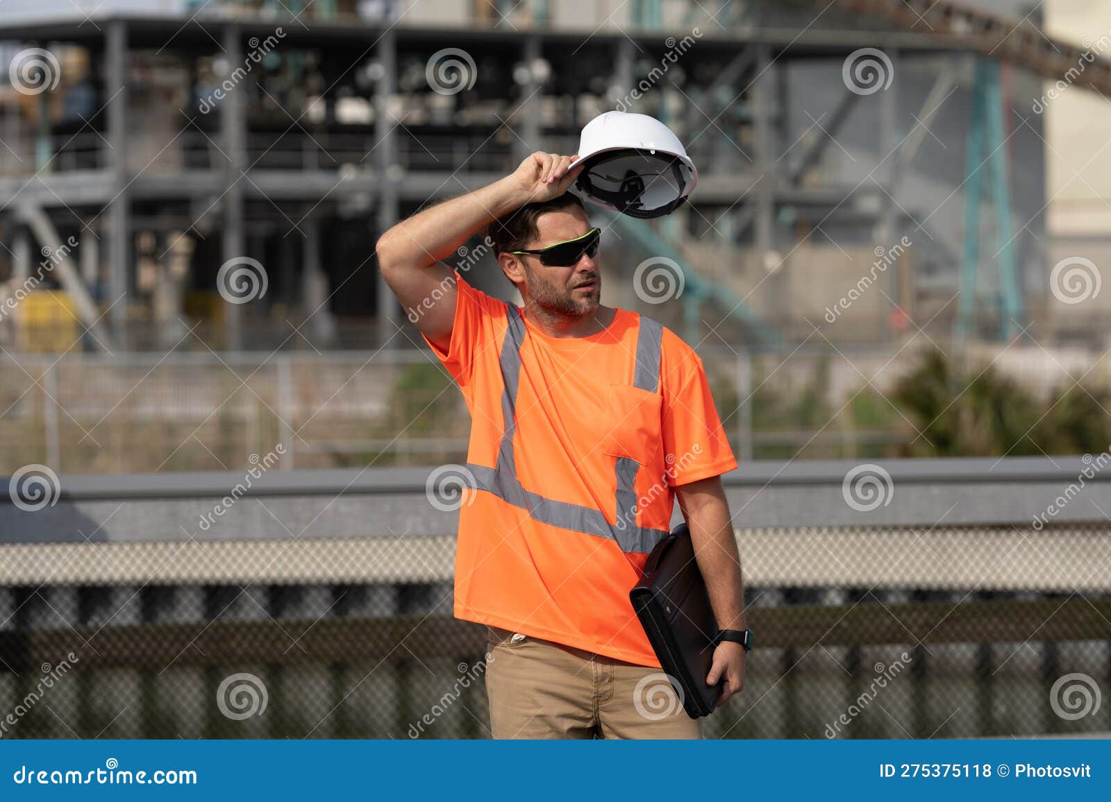 Engineer Man at Construction Site Outdoor. Photo of Engineer Man at ...