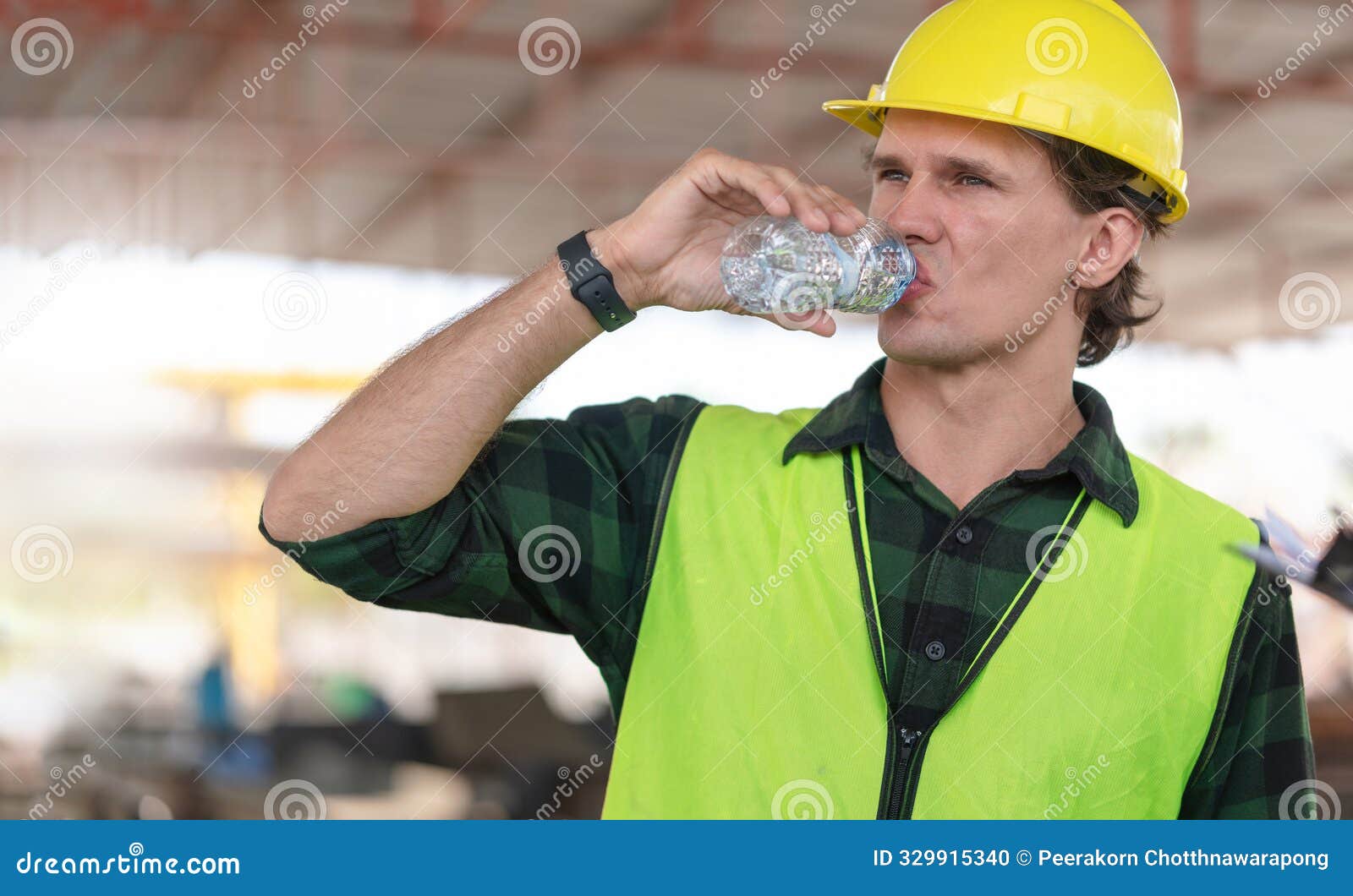 Engineer Man Drinking Water at the Precast Factory Site, Worker Man ...