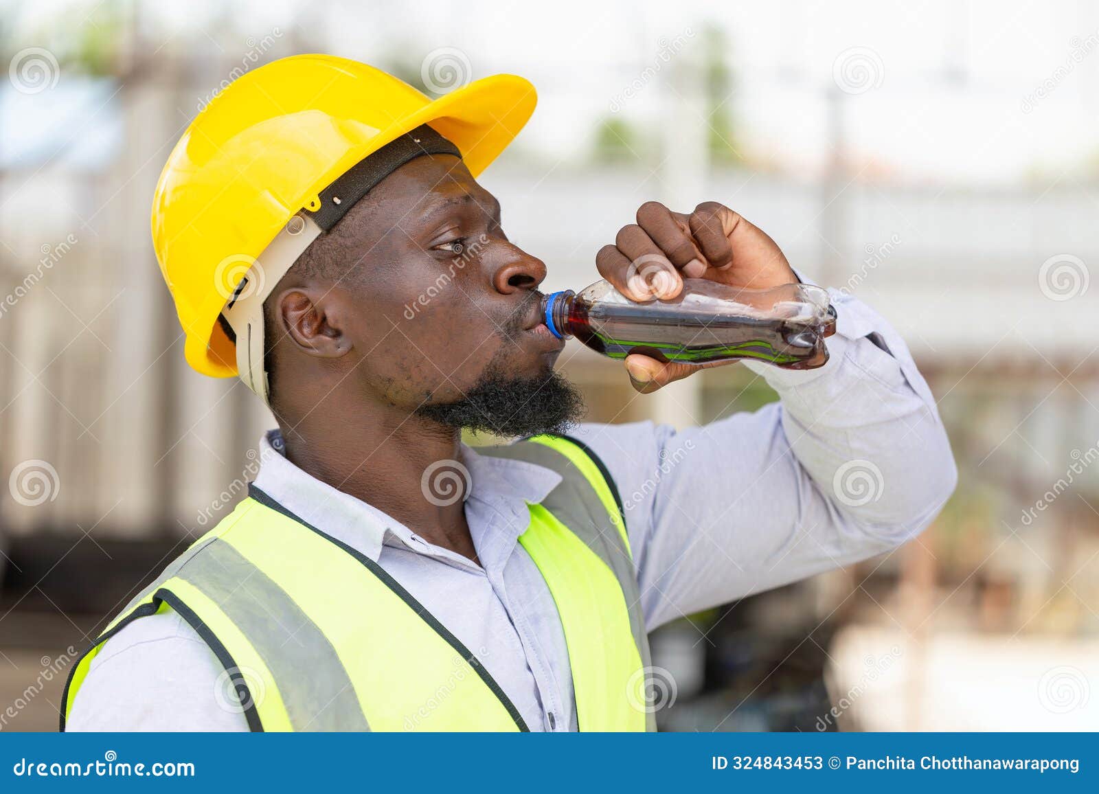 Engineer Man Drinking Water at the Precast Factory Site, Worker Man ...