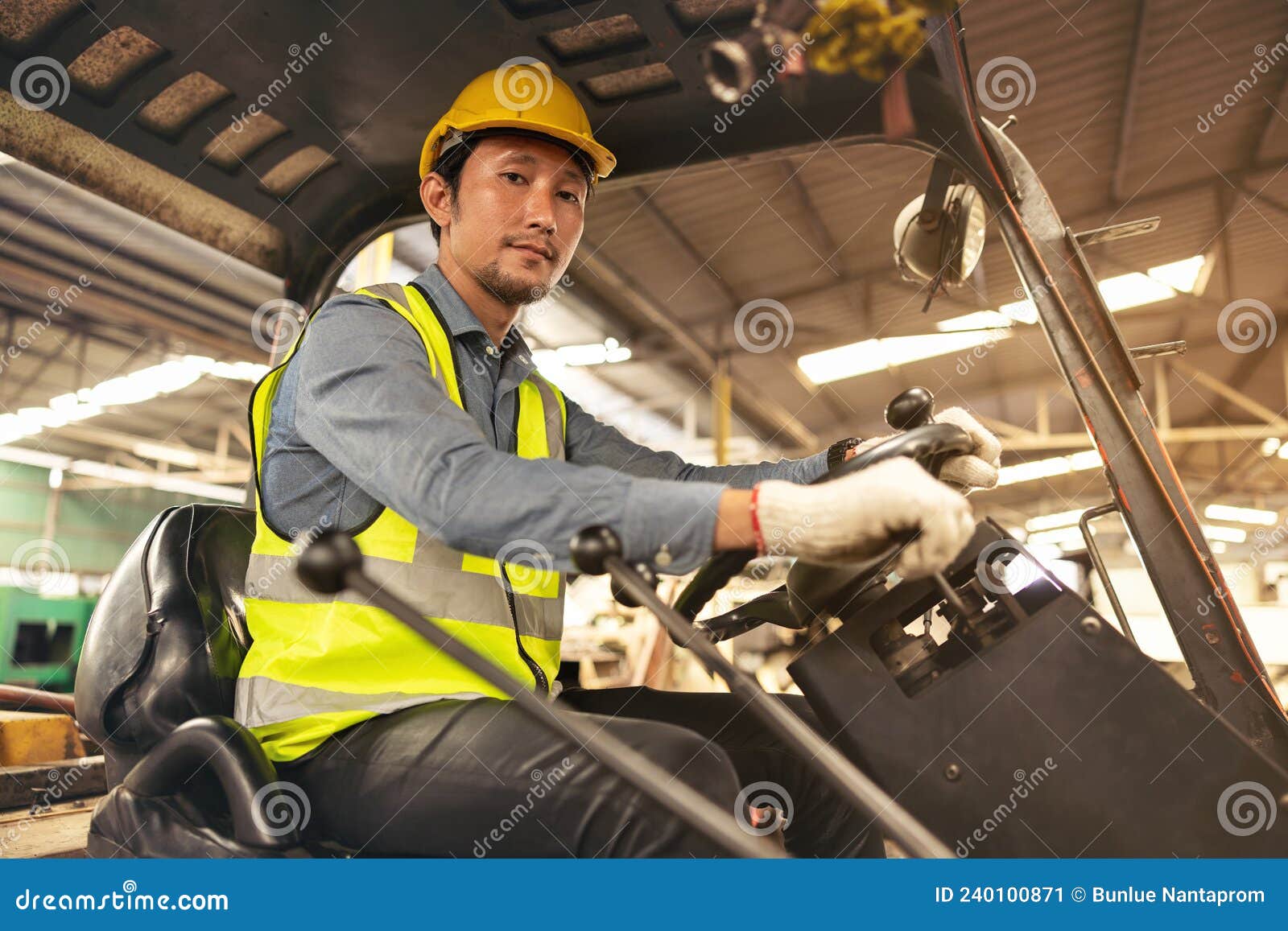 Engineer Man Forklift Driver with a Background in an Industrial or ...