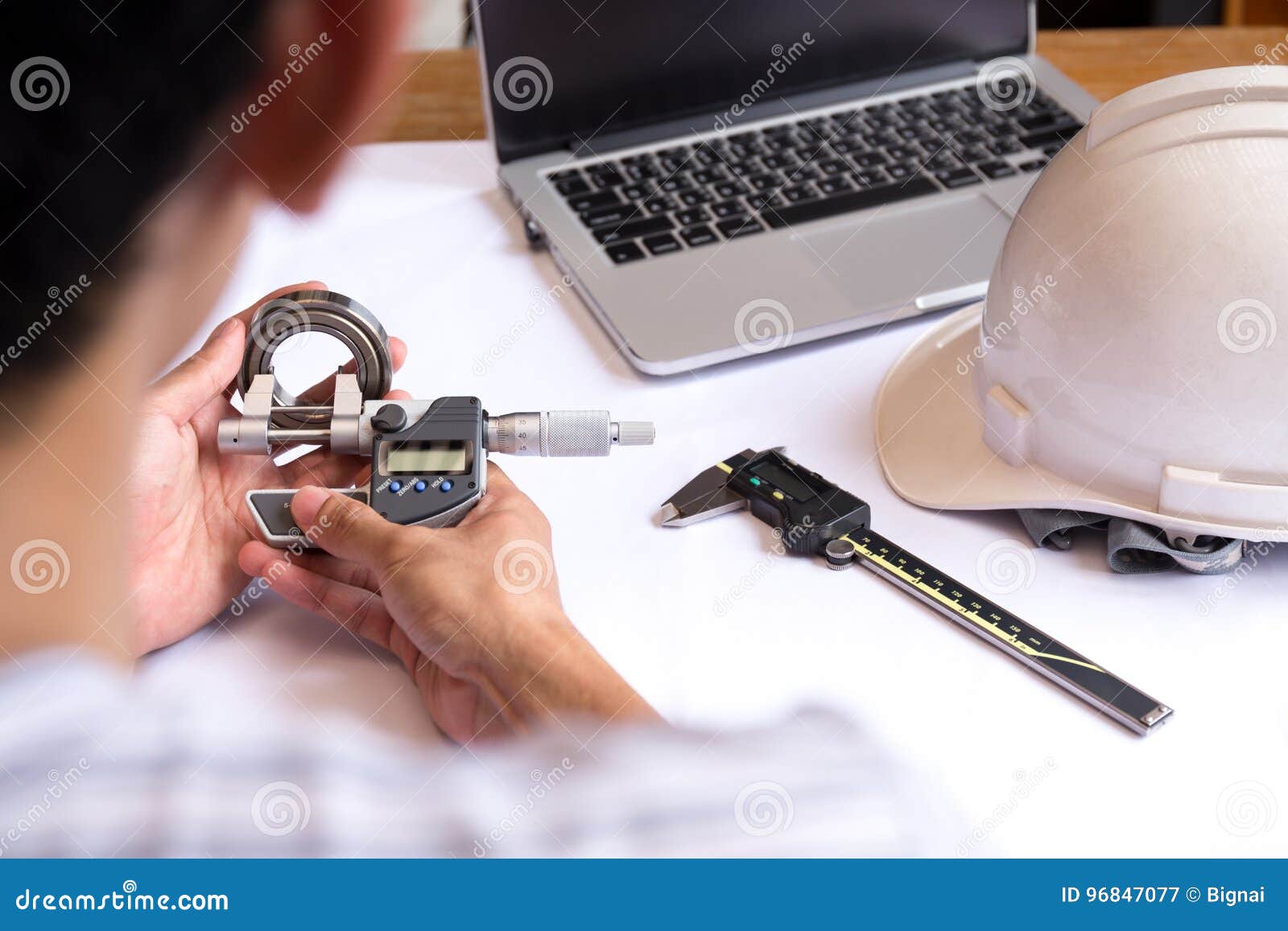 Engineer Man Hand Measuring Bearing with Digimatic Micrometer Stock ...