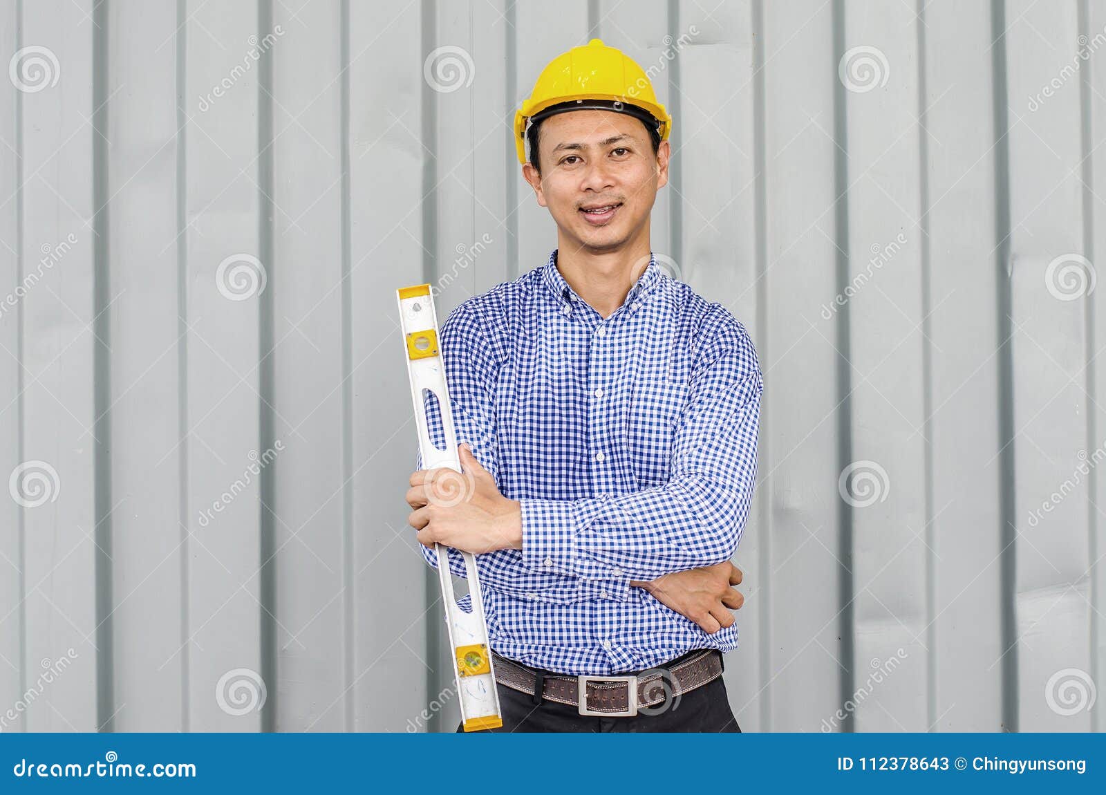 Engineer Man Holding Level Measuring Instrument and Standing at ...