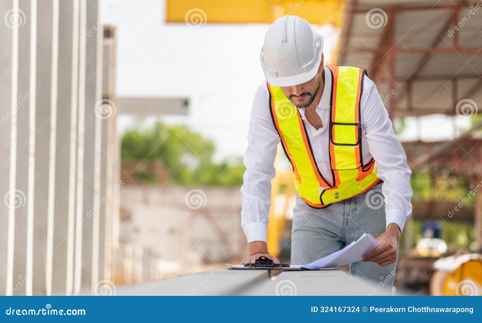 Engineer Man Inspects and Plans Projects in the Factory Site, Foreman ...
