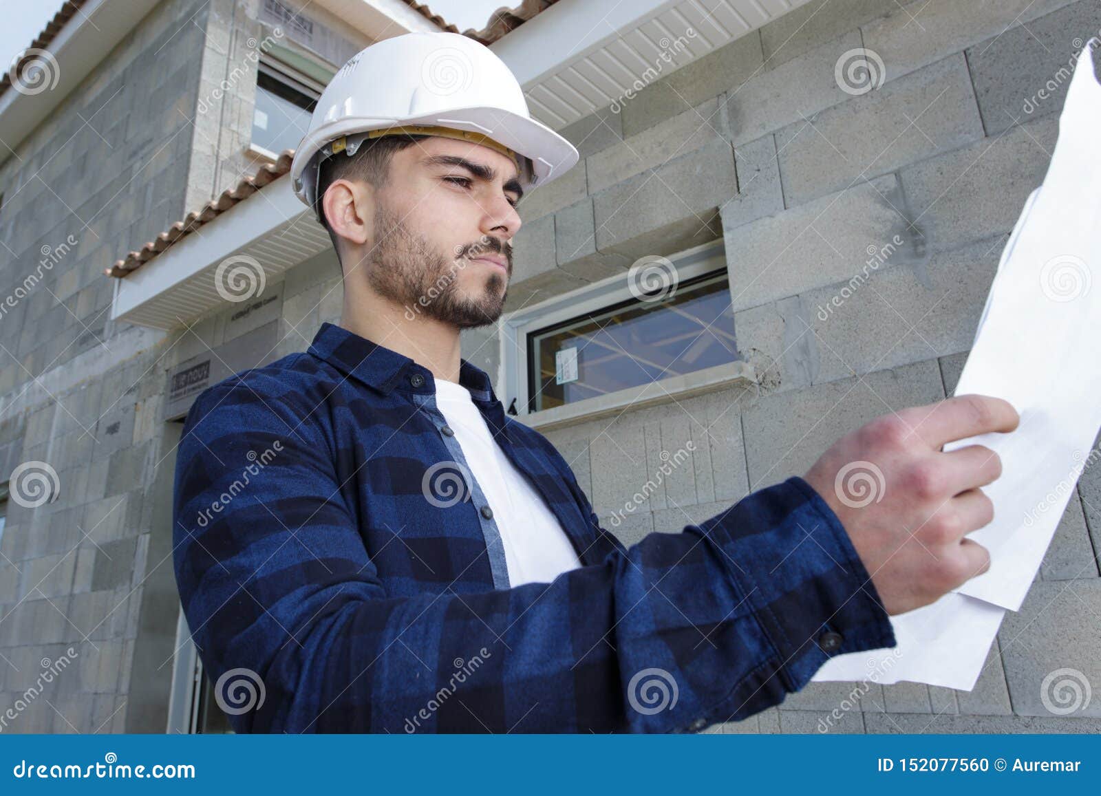 Engineer Man Looking at Plan on Construction Site Stock Photo - Image ...