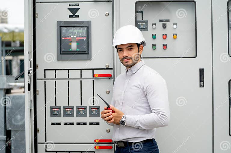 Engineer Man or Technician Hold Walkie Talkie with Look at Camera and Stand in Front of ...