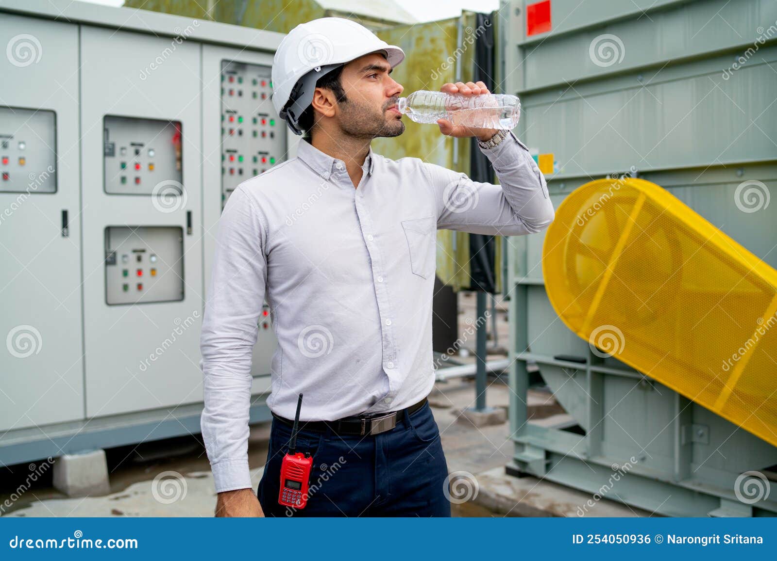 Engineer Man or Technician Worker Drink Water from Bottle and Stand in ...