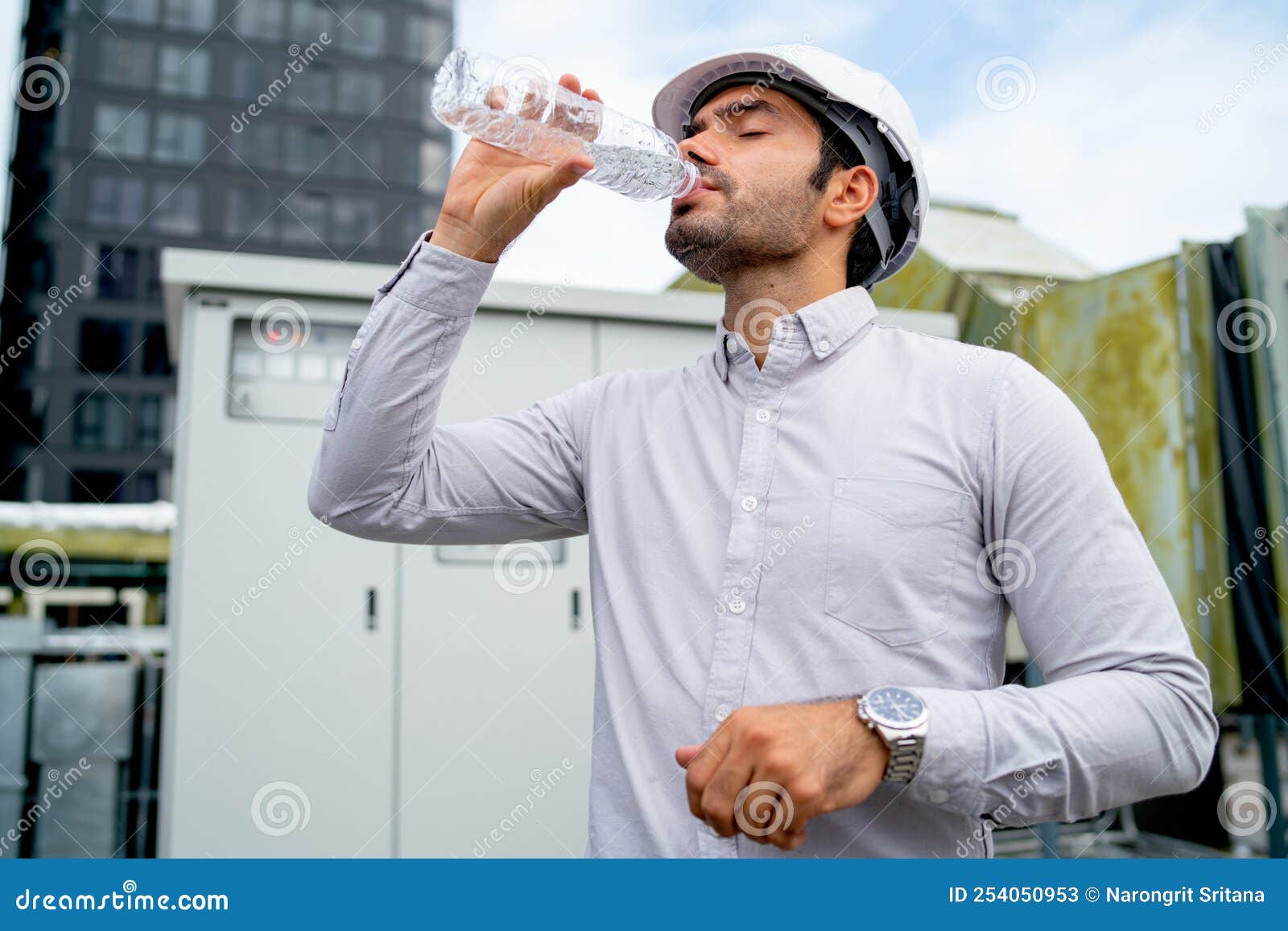 Engineer Man or Technician Worker Drink Water from Bottle and Stand in ...