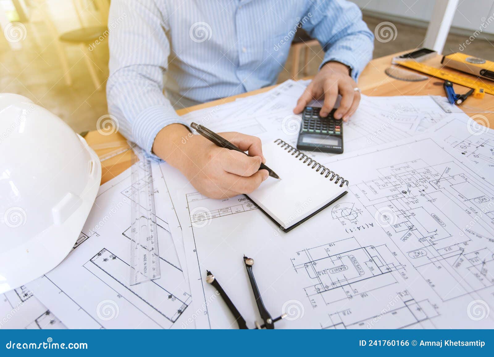 Engineer Man Working in the Office, Drawing the Construction Project ...