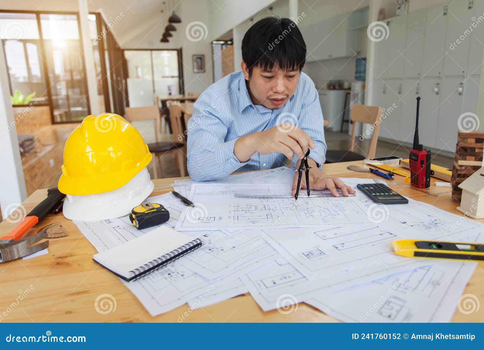 Engineer Man Working in the Office, Drawing the Construction Project ...