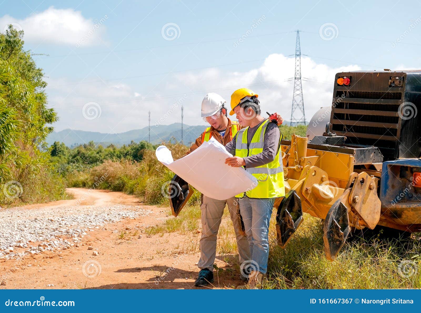 Engineer Manager Discuss with His Team and Stand in Front of Tractor in ...