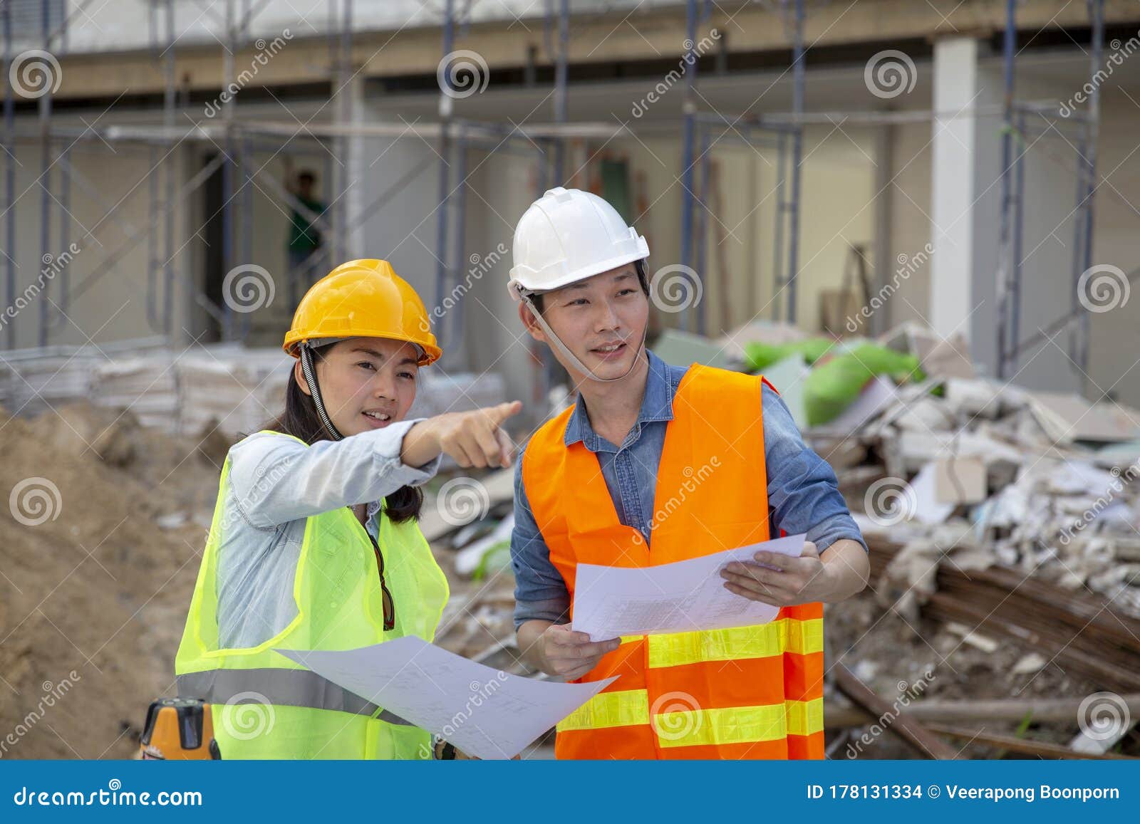 Engineer Manager Inspects Construction Sites and Checking Blueprints at ...
