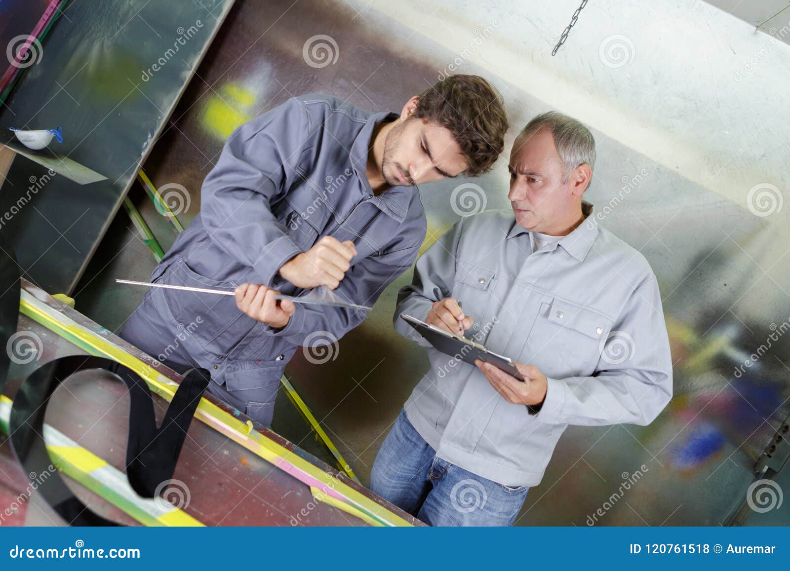 Engineer and Manager Working in Mechanic Storage Room Stock Photo ...