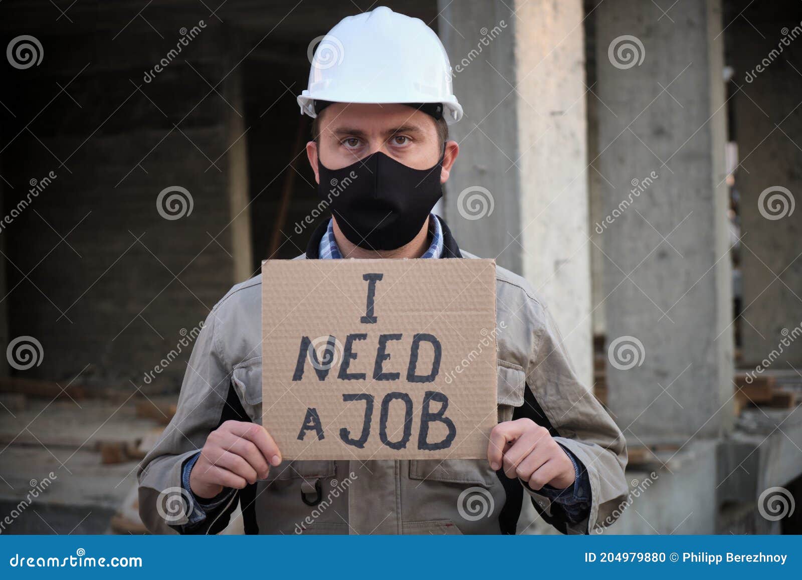Engineer in Mask and Hardhat Stands with Placard I Need a Job Stock ...