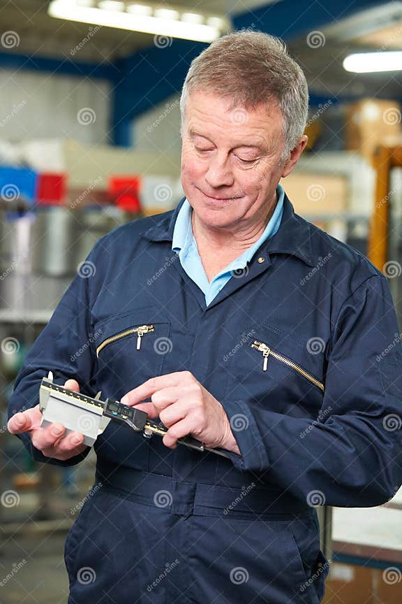 Engineer Measuring Component with Micrometer Stock Photo - Image of ...
