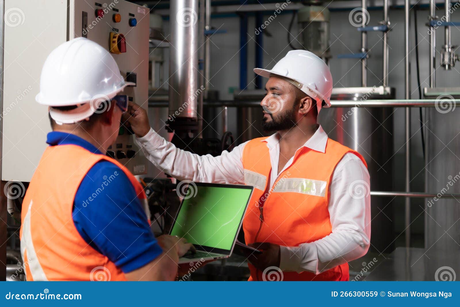 Engineer of a Mechanical Plant Inspecting and Explaining the ...