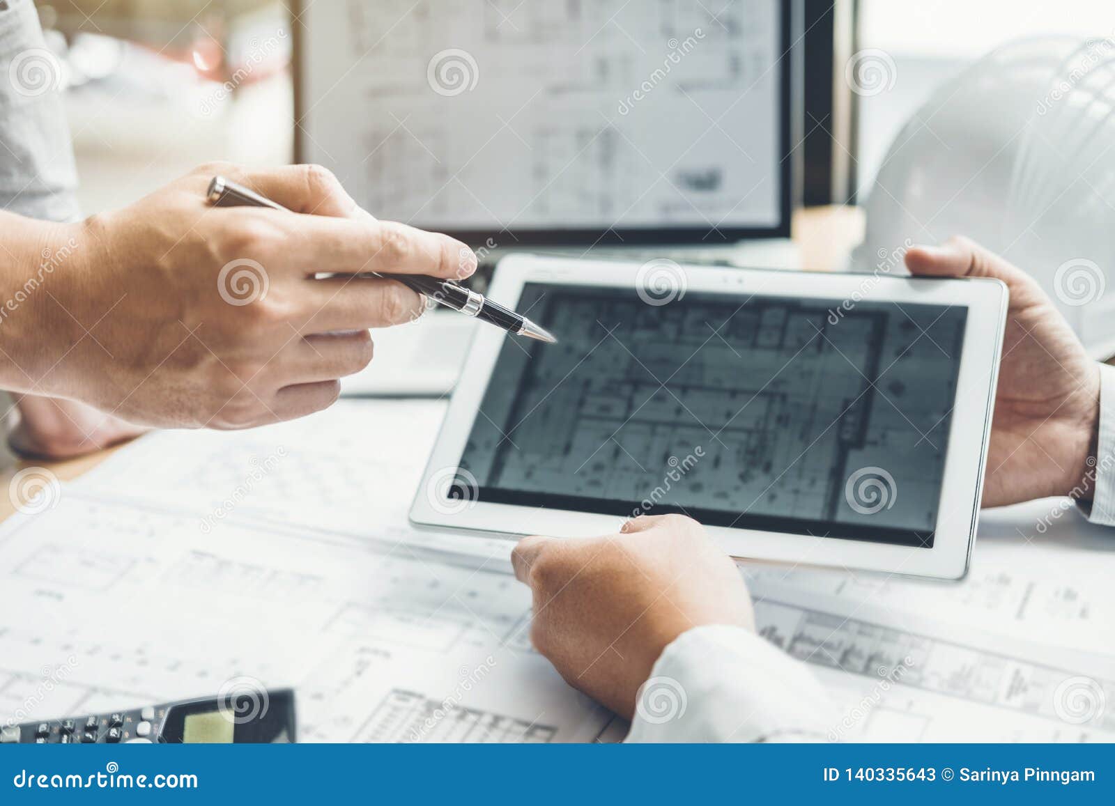Engineer Meeting and Using Digital Tablet for Architectural Project and ...