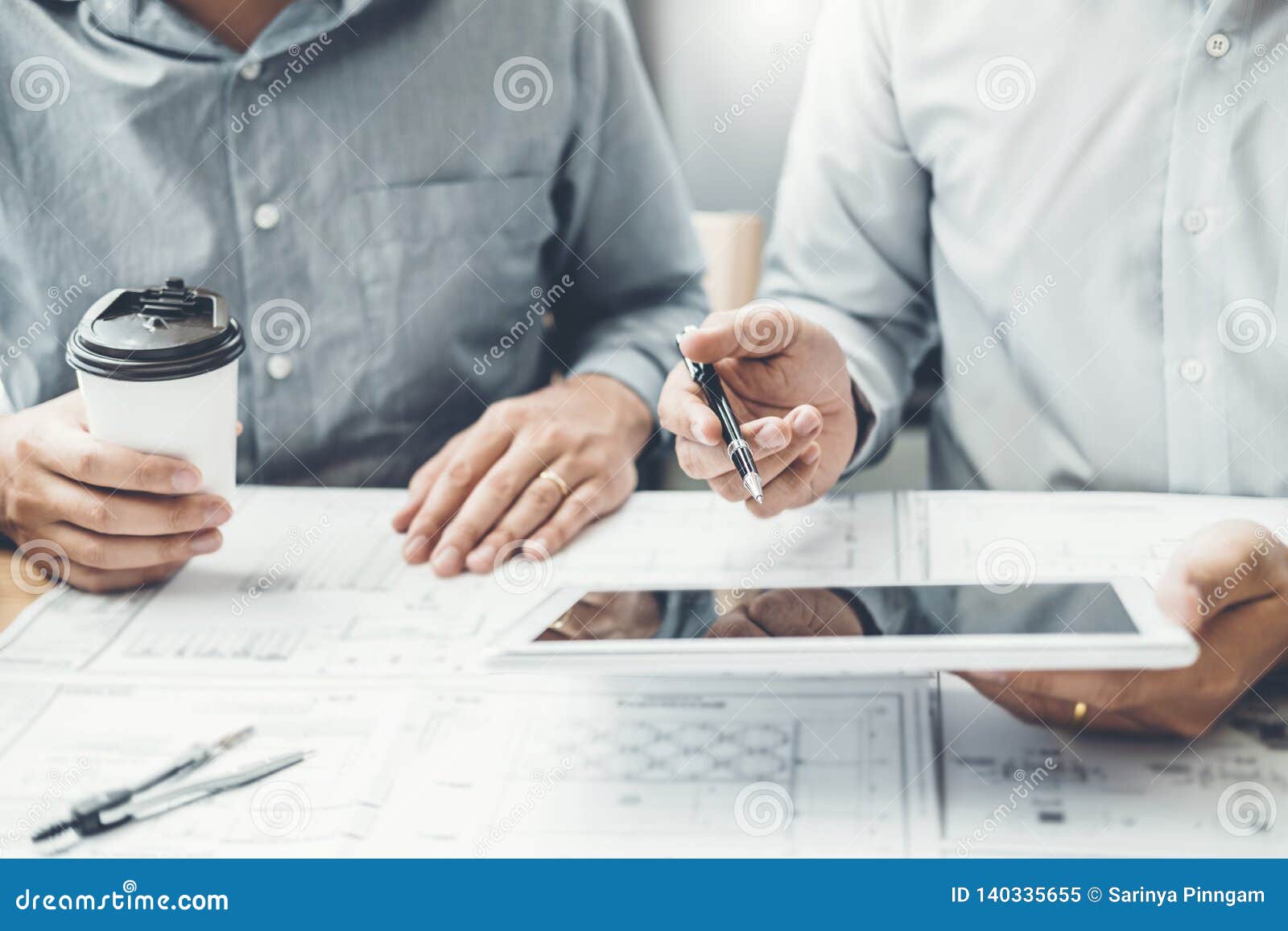 Engineer Meeting and Using Digital Tablet for Architectural Project and ...