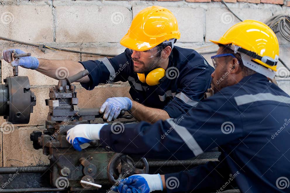 Engineer Man Training with Foreman for Apprentice Using Lathe ...
