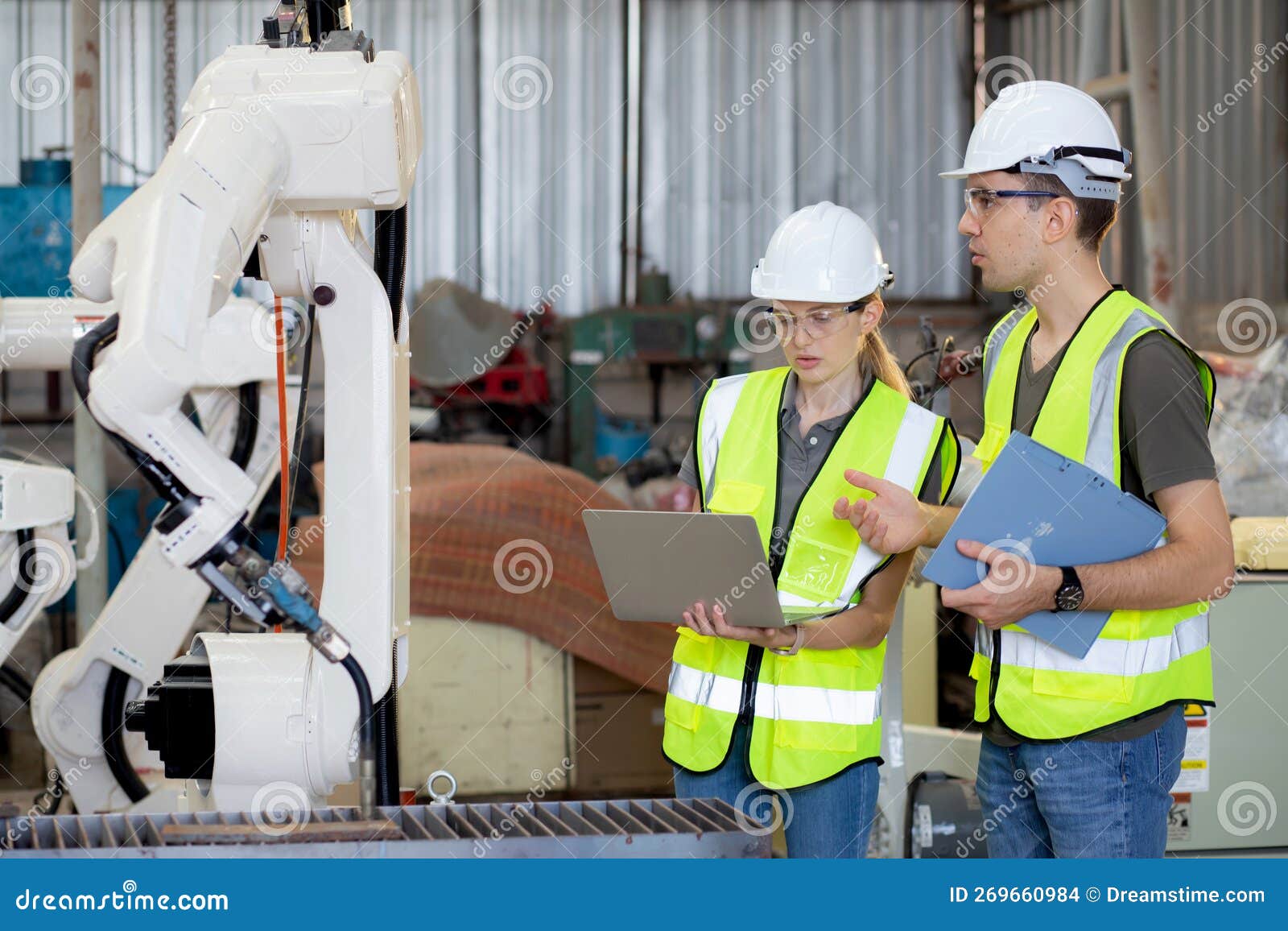 Engineer Man and Woman Talking and Explaining about Robot Arms ...