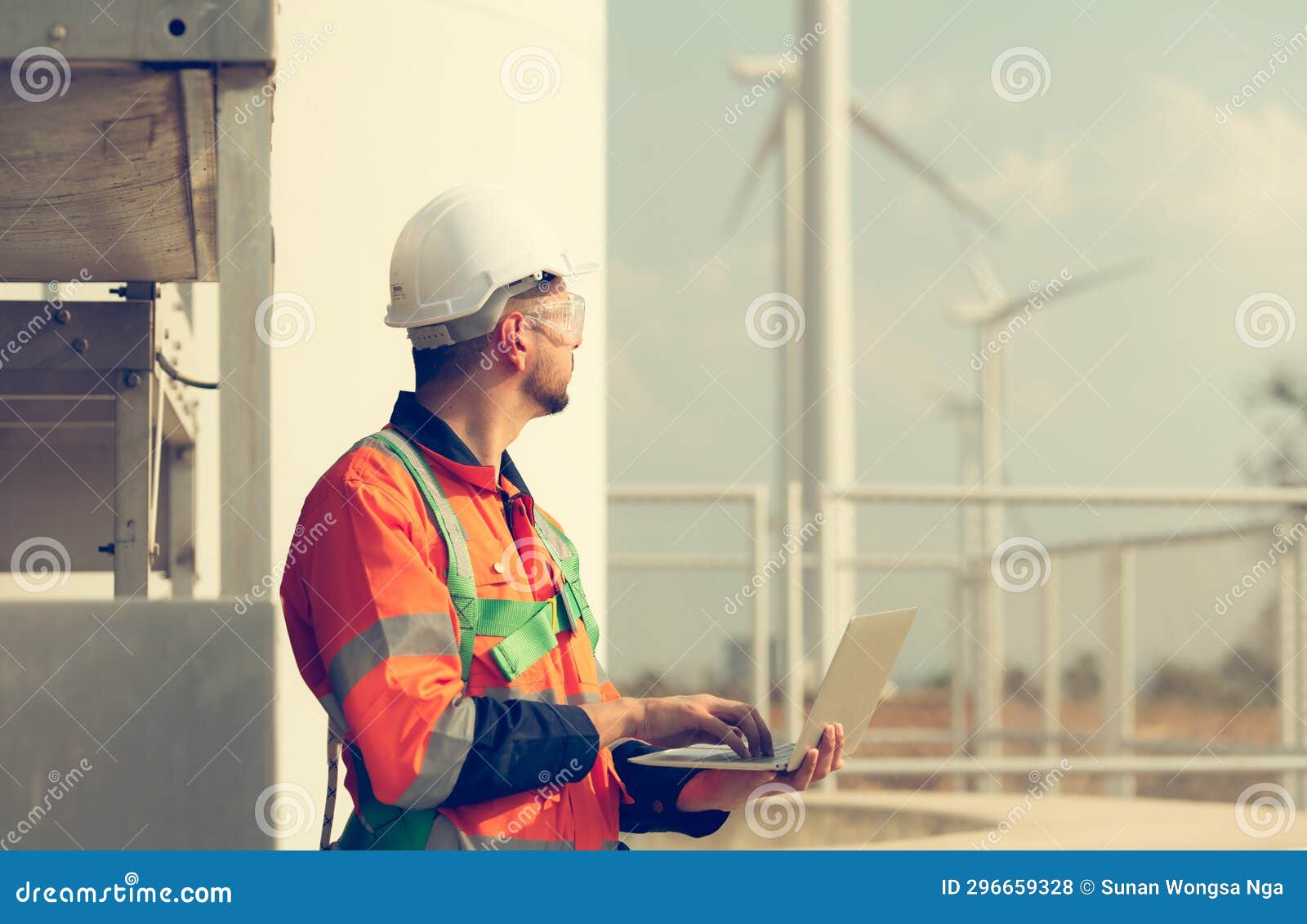 Engineer at Natural Energy Wind Turbine Site Must Use a Computer To ...