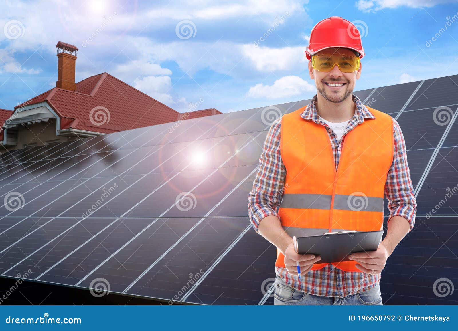 Engineer Near House with Installed Solar Panels. Alternative Energy ...