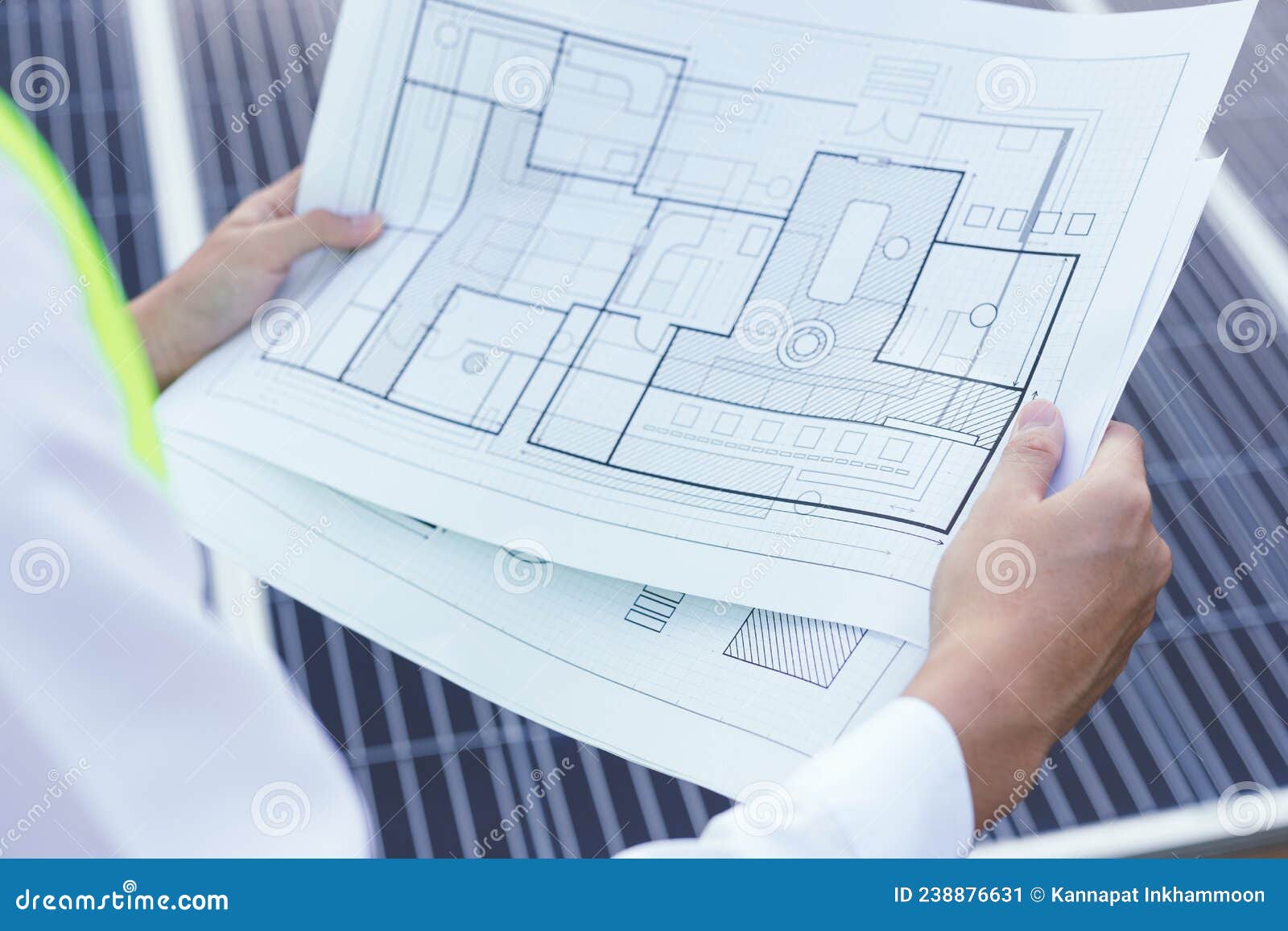 Engineer Open Blueprint of Solar Farm Project on Solar Cells Panel ...