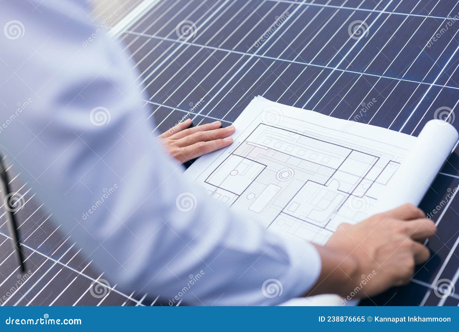 Engineer Open Blueprint of Solar Farm Project on Solar Cells Panel ...
