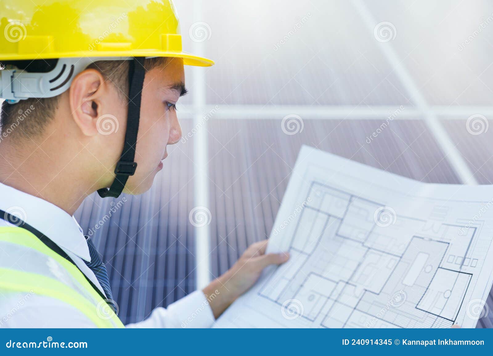 Engineer Open Blueprint of Solar Farm Project on Solar Cells Panel ...