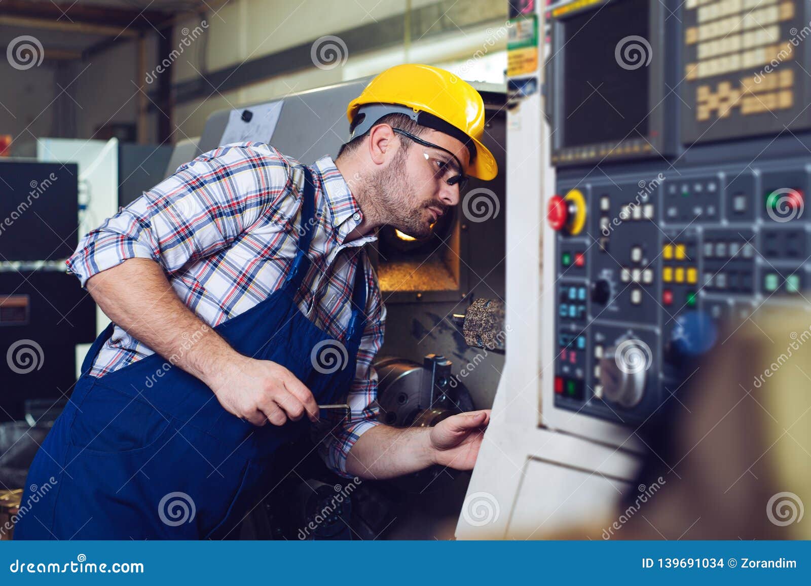 Engineer Operating CNC Machinery in Factory Stock Photo - Image of male ...
