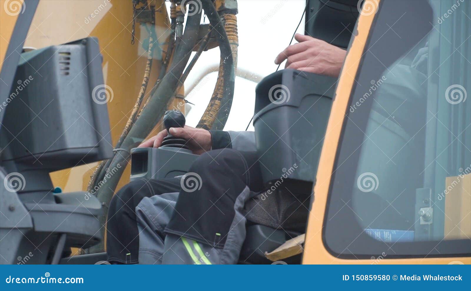 Engineer Operator Crane in Action. Clip. Man in Cabin Controls the ...
