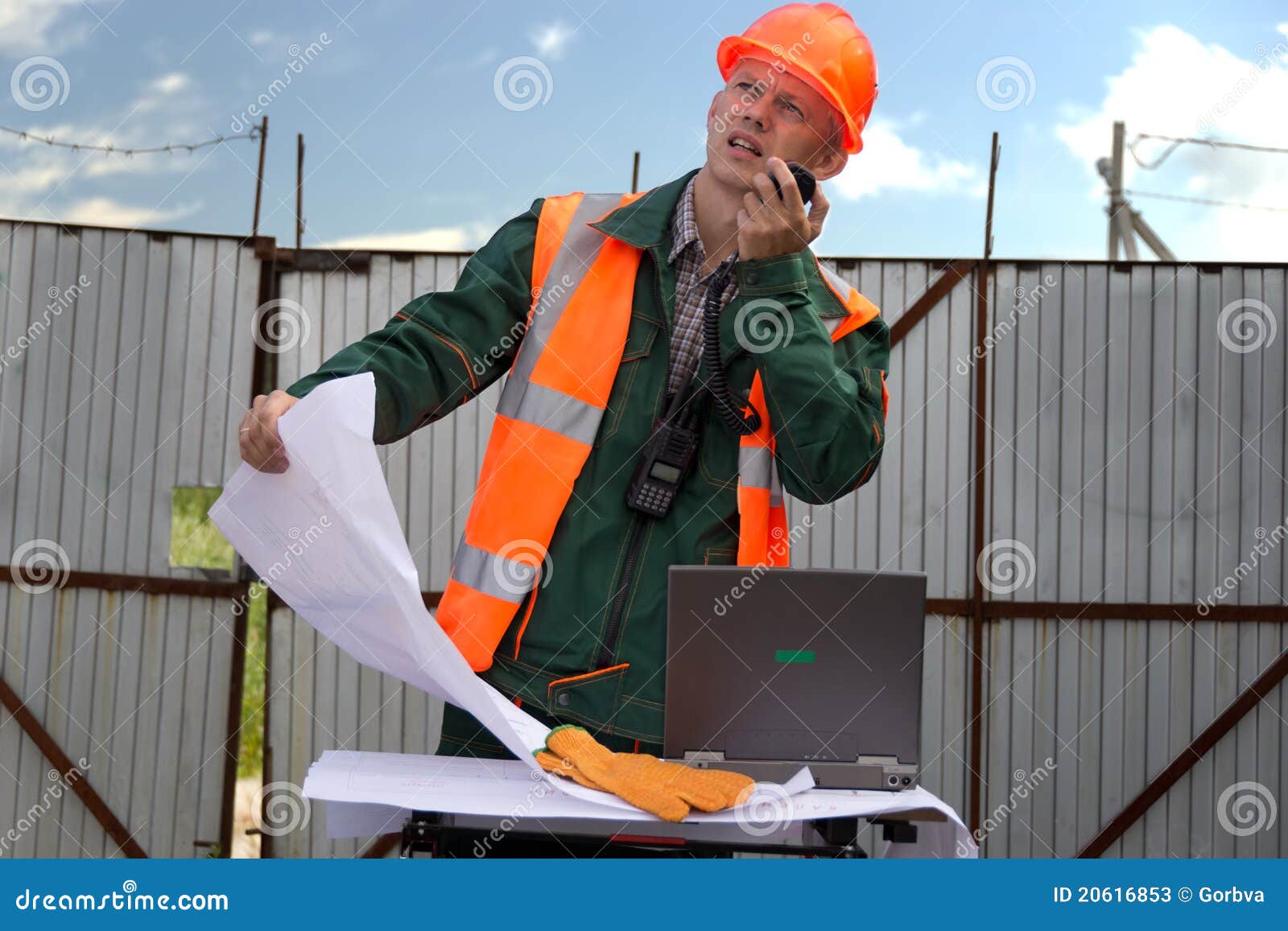 Engineer in Orange Jacket and Helmet Talk by Radi Stock Image - Image ...
