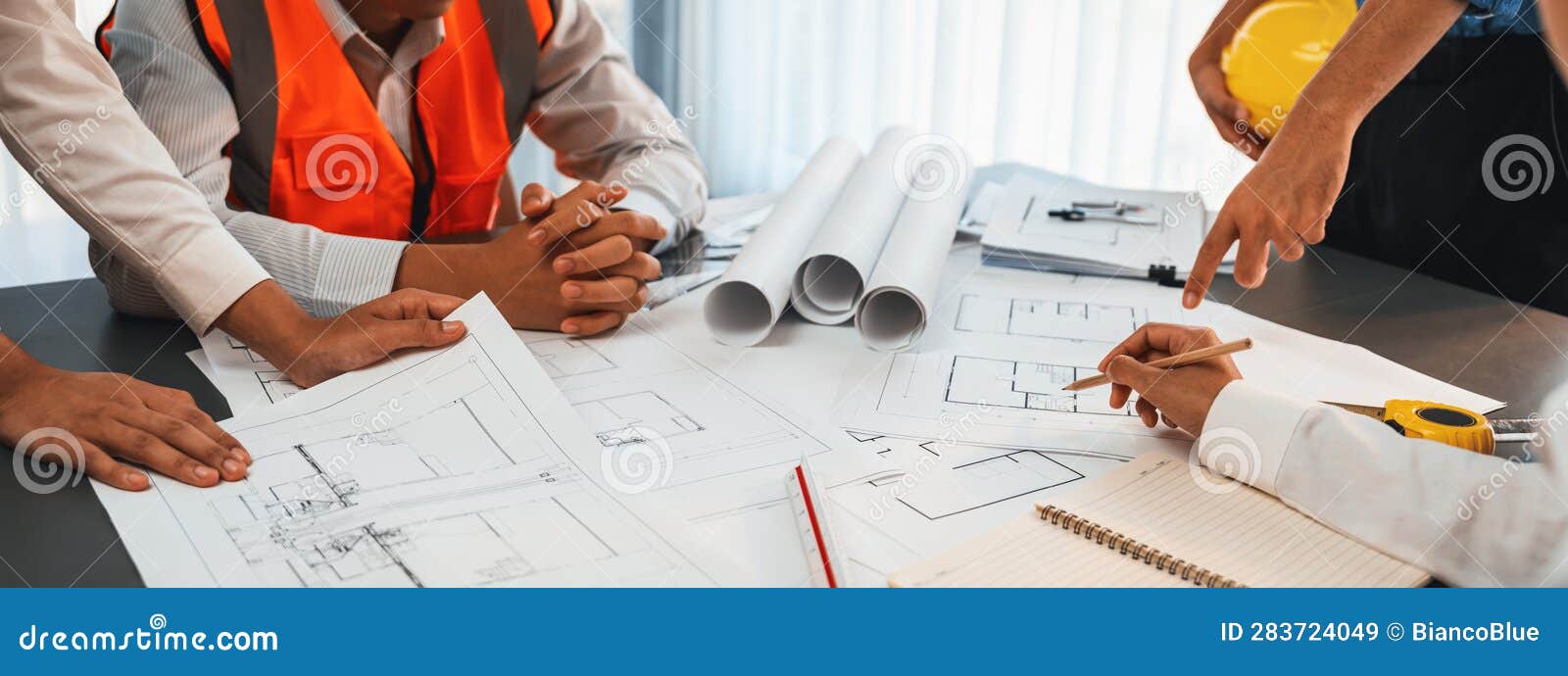 Engineer Partner Drawing and Working on Blueprint Design Together ...