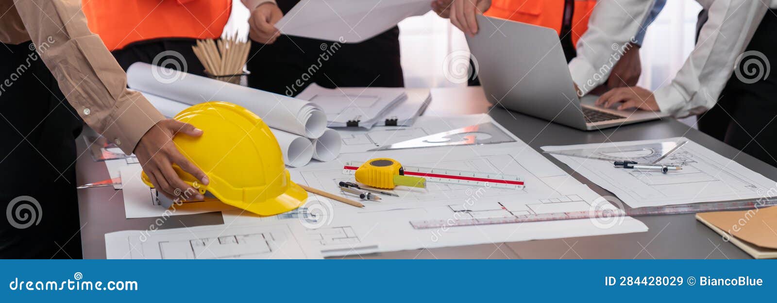 Engineer Partner Drawing and Working on Blueprint Design Together ...