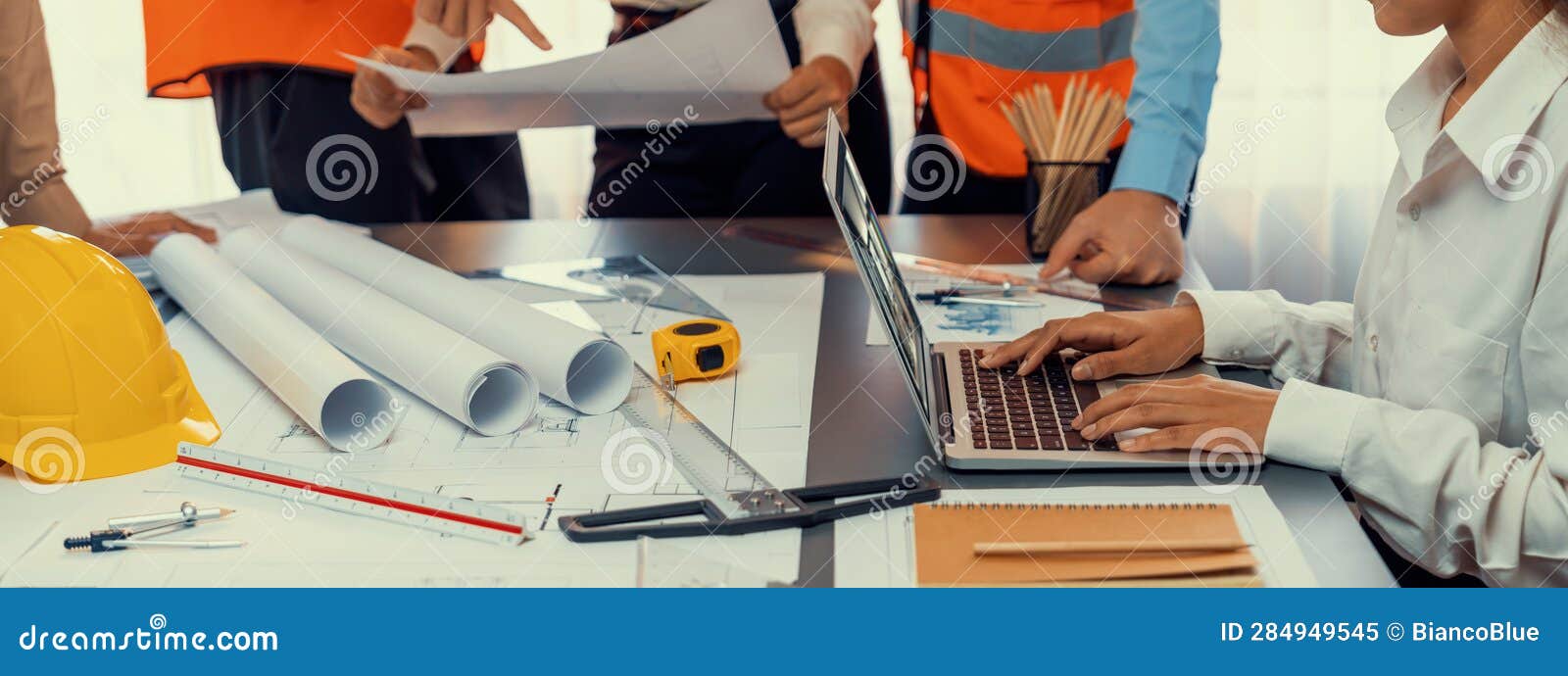 Engineer Partner Drawing and Working on Blueprint Design Together ...