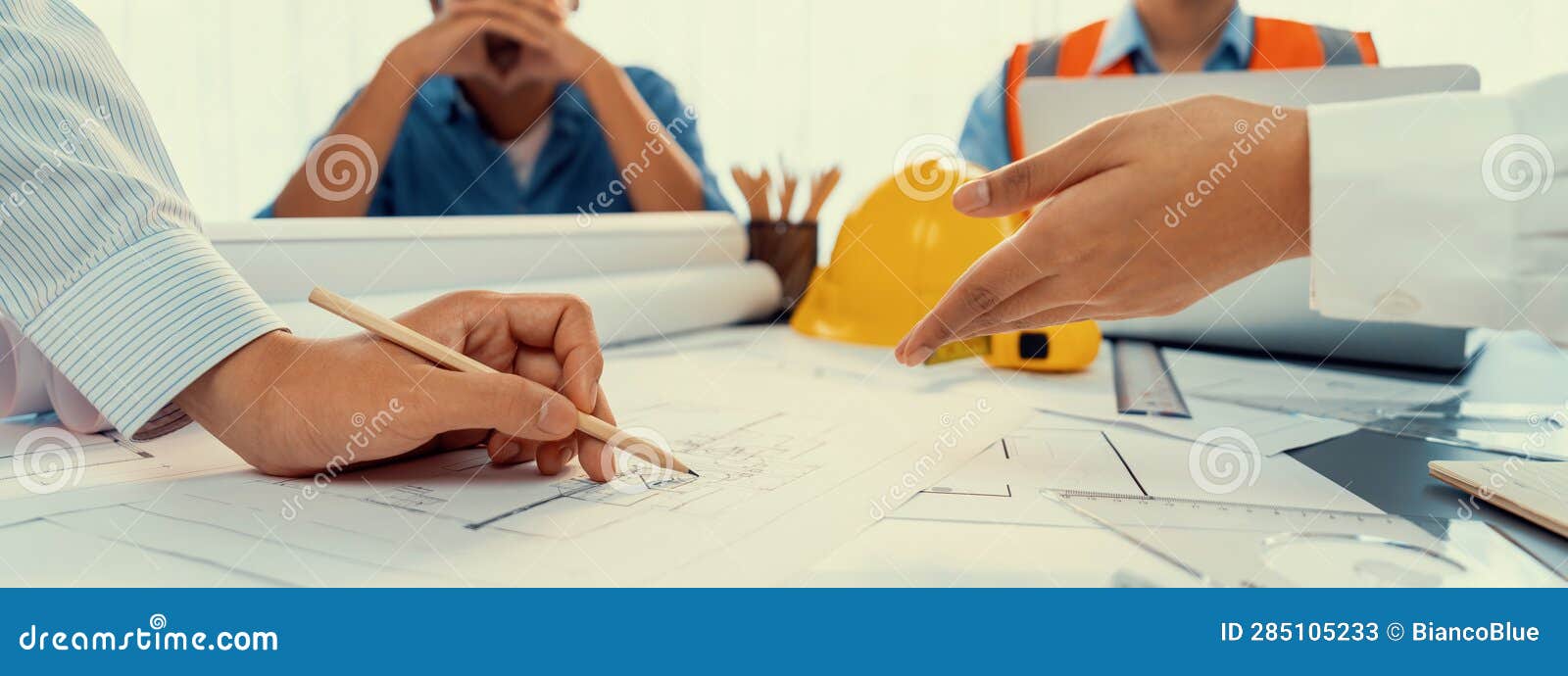 Engineer Partner Drawing and Working on Blueprint Design Together ...