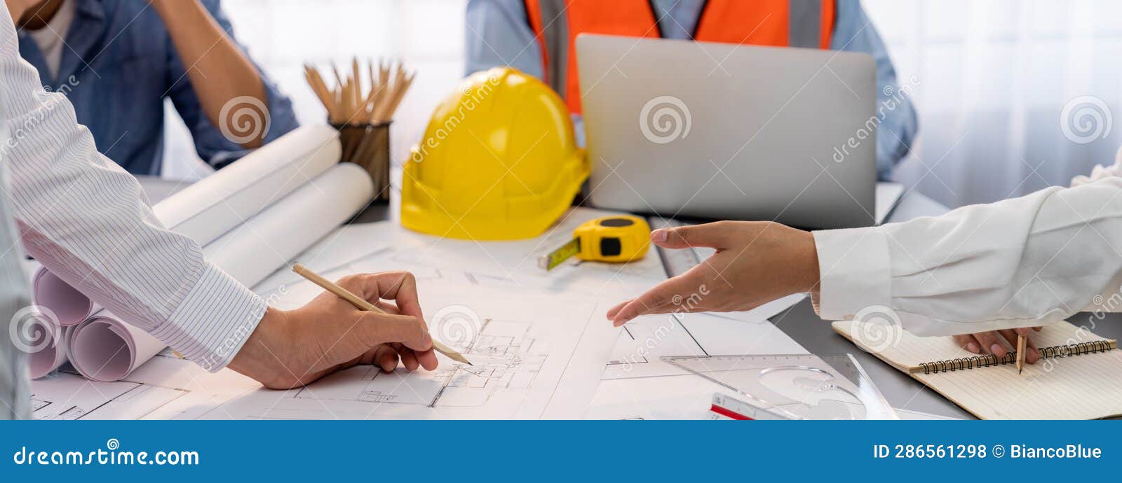 Engineer Partner Drawing and Working on Blueprint Design Together ...