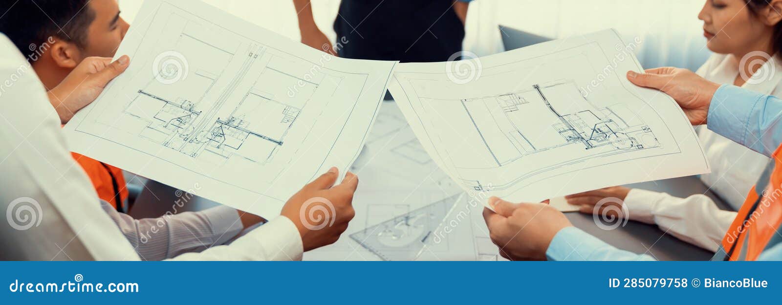 Engineer Partner Drawing and Working on Blueprint Design Together ...