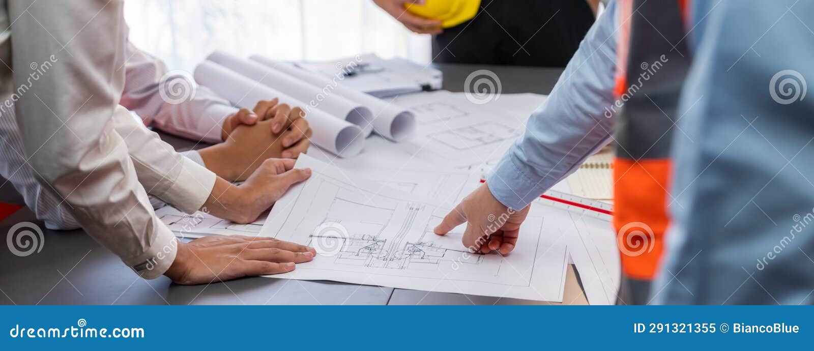 Engineer Partner Drawing and Working on Blueprint Design Together ...