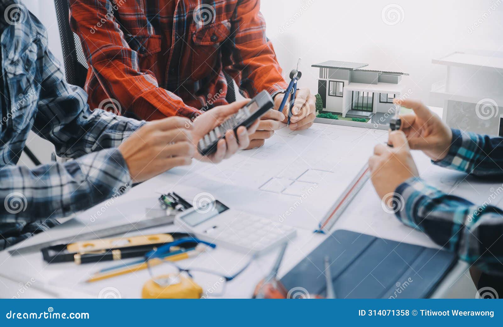 Engineer People Meeting Working and Pointing at a Drawings in Office ...