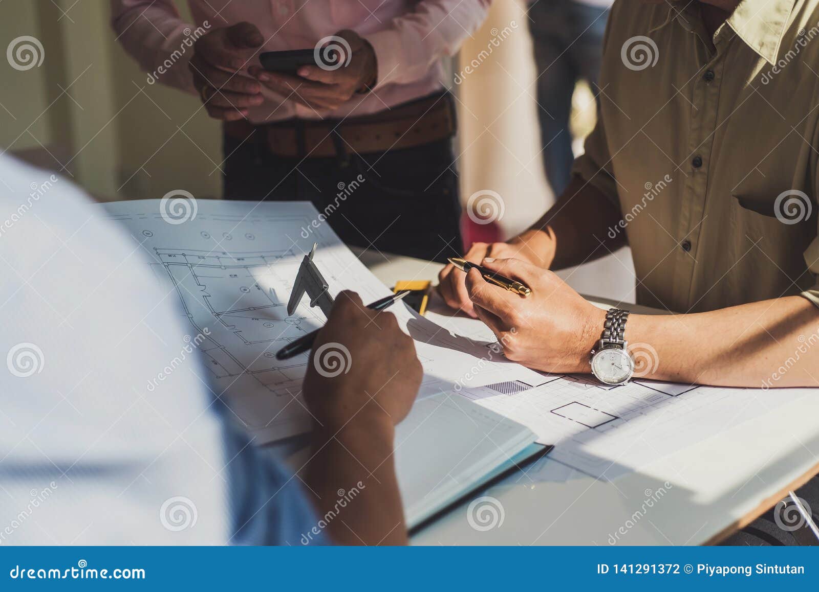 Engineer People Meeting Working and Pointing at a Drawings in Office ...