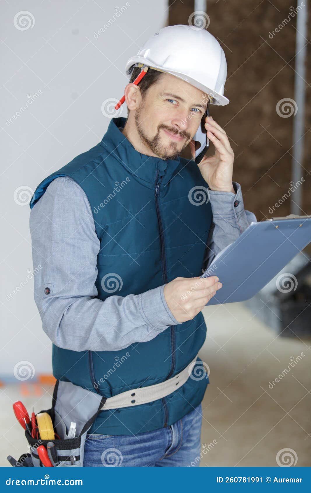 Engineer on the phone stock image. Image of architecture - 260781991