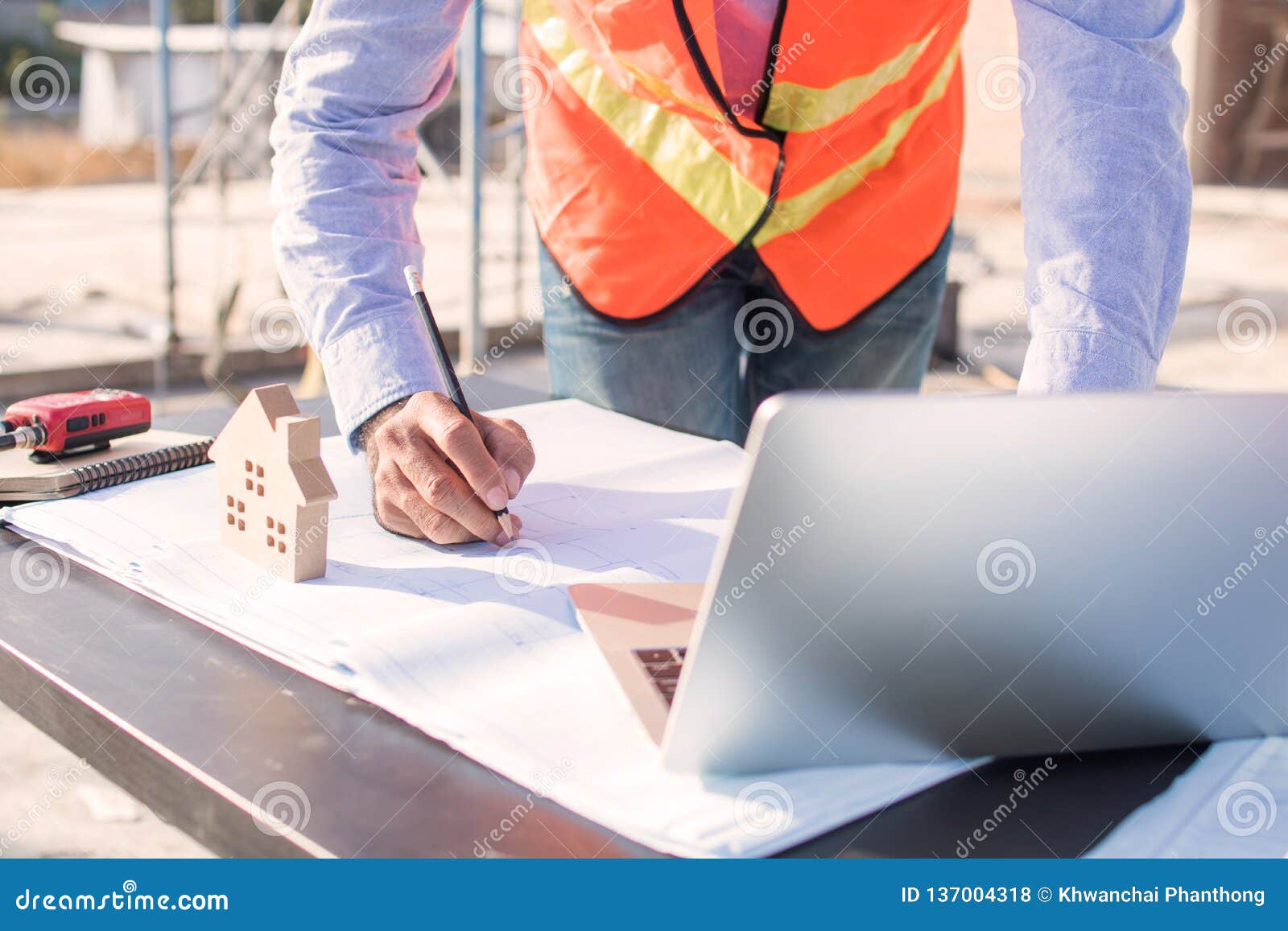 Engineer Planing and Working on Table in Construction Working Site ...