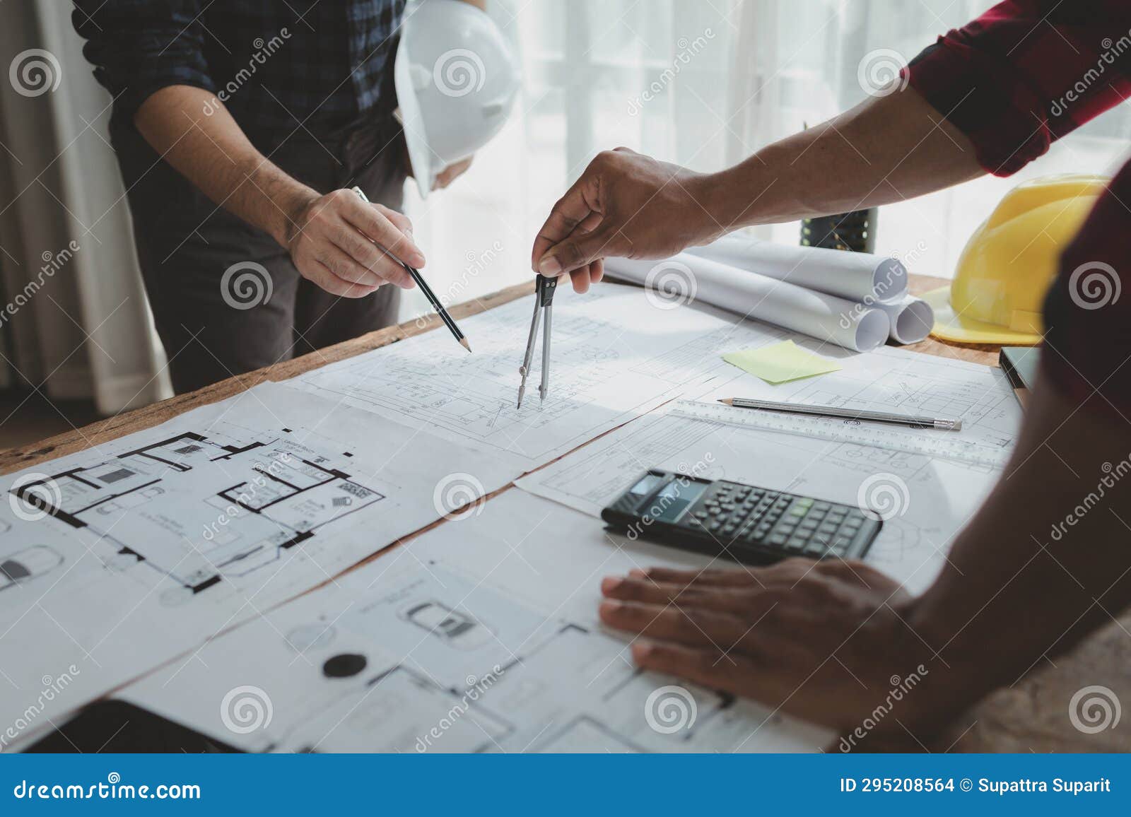 Engineer is in Planning Meeting with Architect about Building a House ...