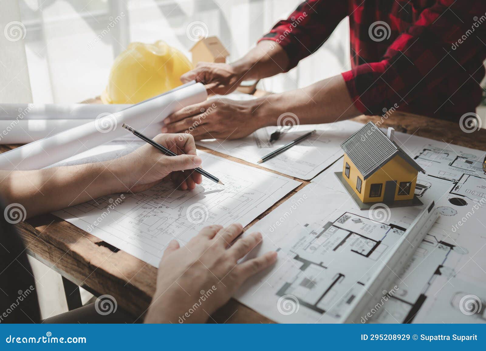 Engineer is in Planning Meeting with Architect about Building a House ...