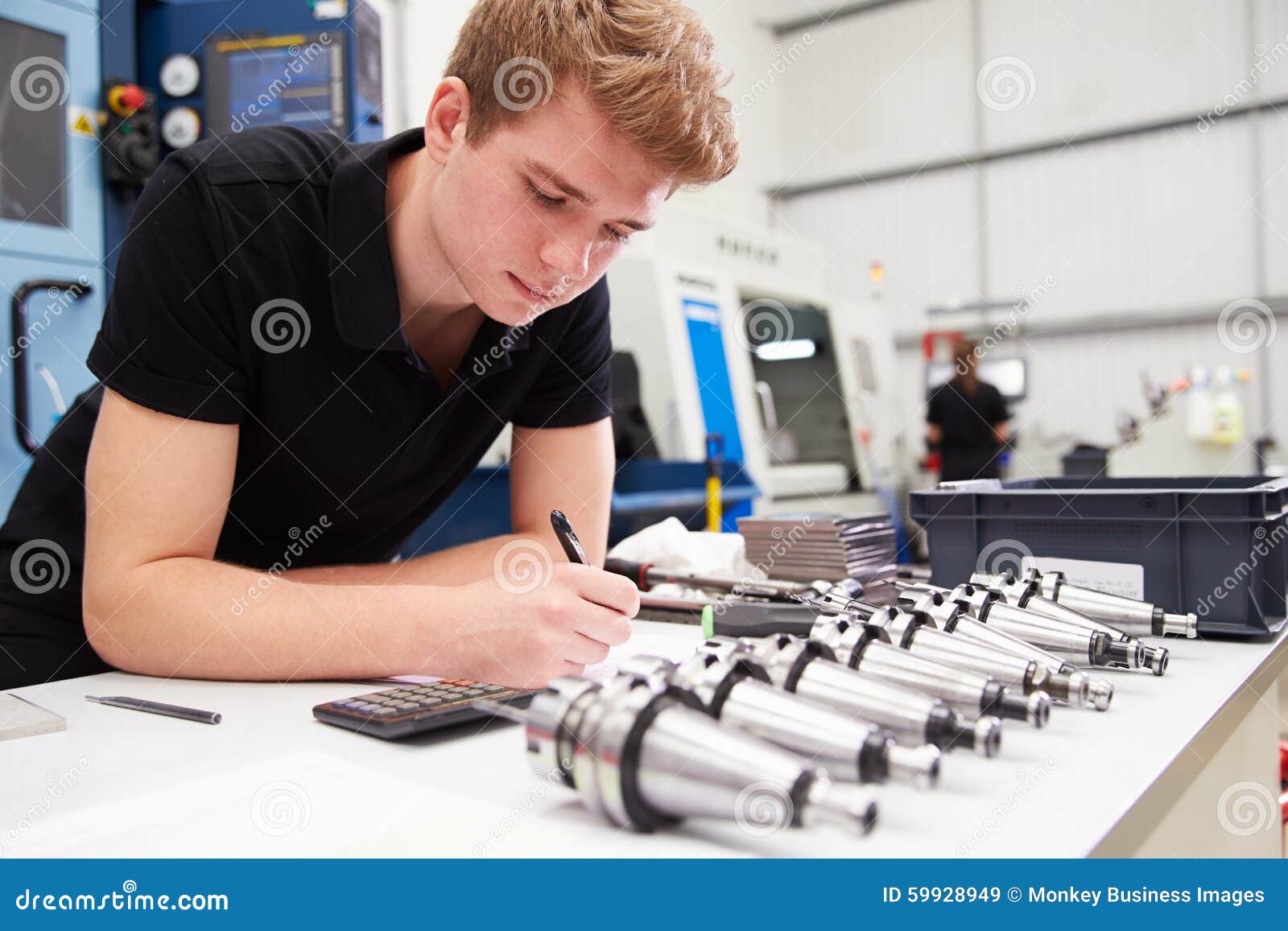 Engineer Planning Project with CNC Machinery in Background Stock Image ...