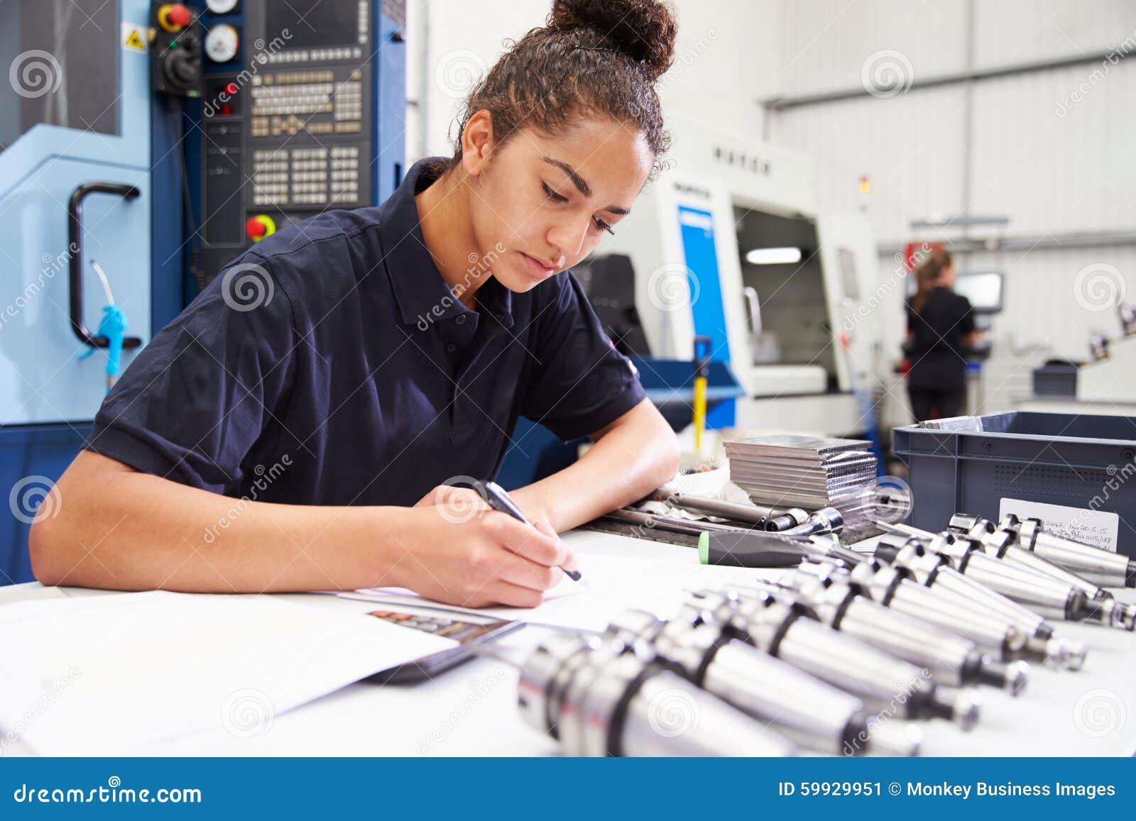 Engineer Planning Project with CNC Machinery in Background Stock Image ...