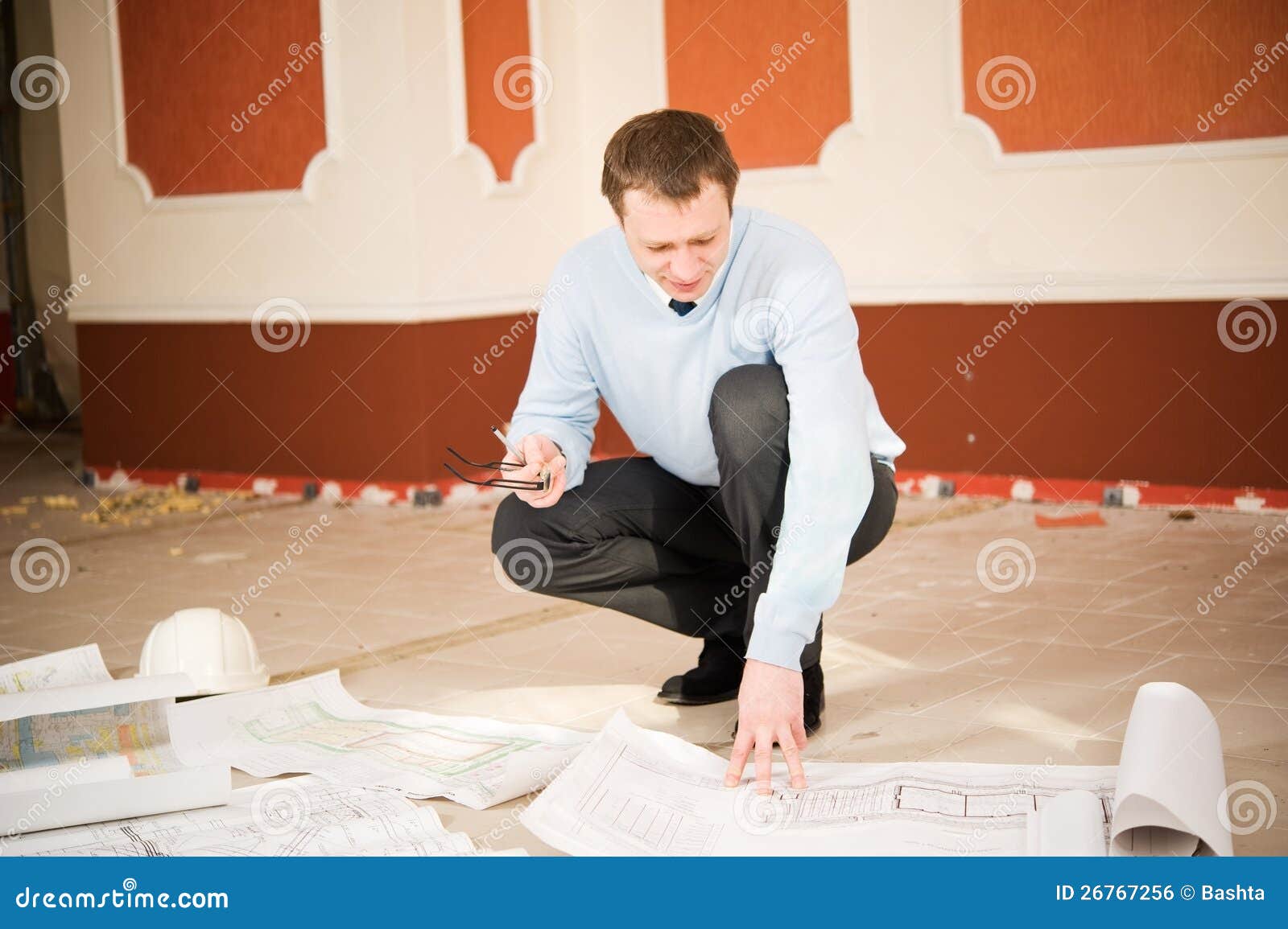 Engineer with plans. stock photo. Image of expertise - 26767256