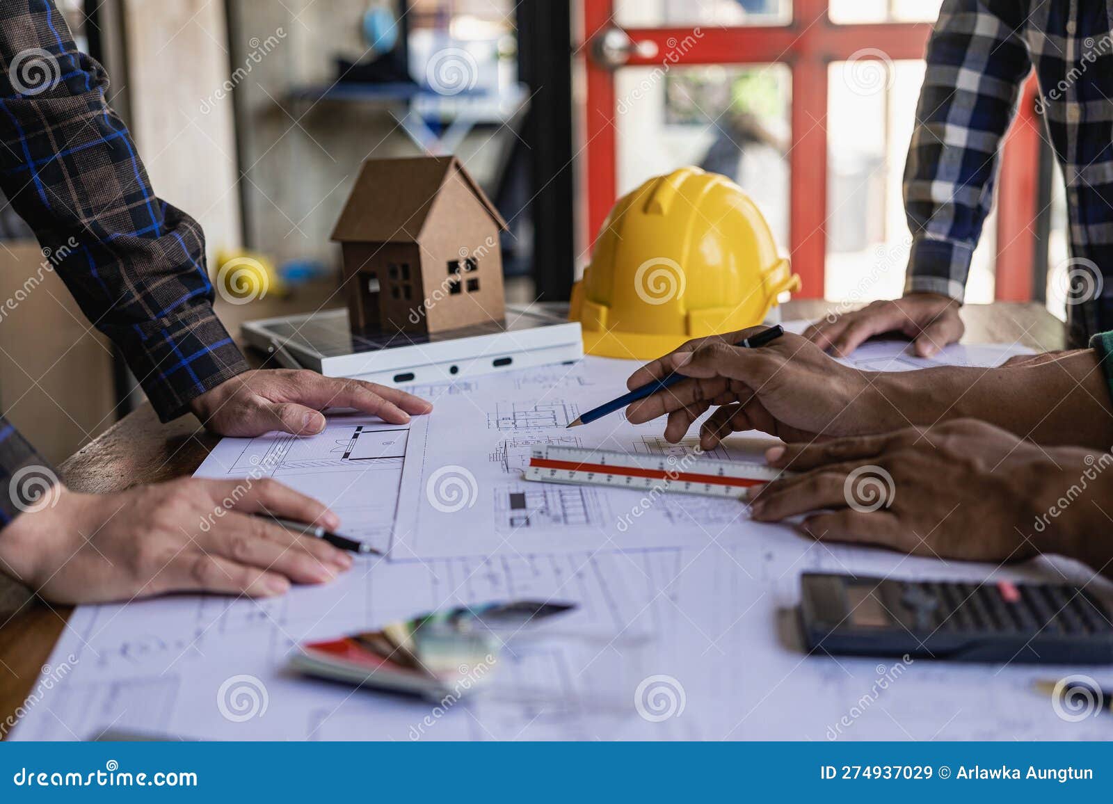 Engineer Pointing at Blueprint and Using Laptop To Draw Project Design ...