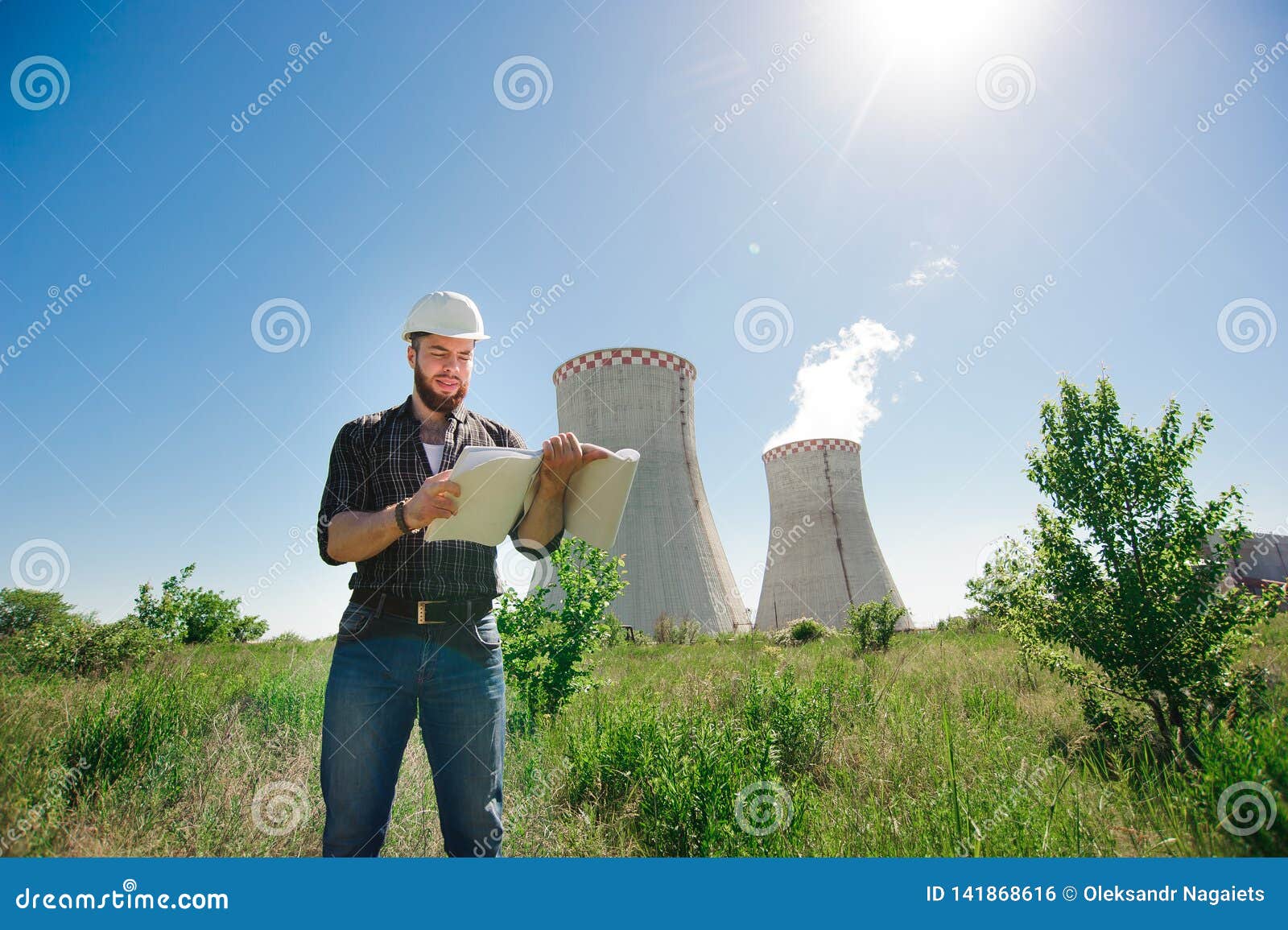 The Engineer Reads the Instruction. Handsom Electrical Engineer at an ...